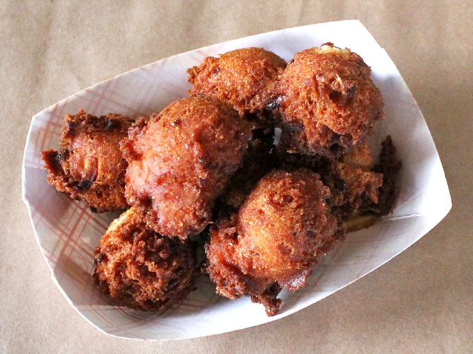 Golden-fried hush puppies with crispy exteriors giving way to soft, savory centers. Southern comfort in bite-sized form.