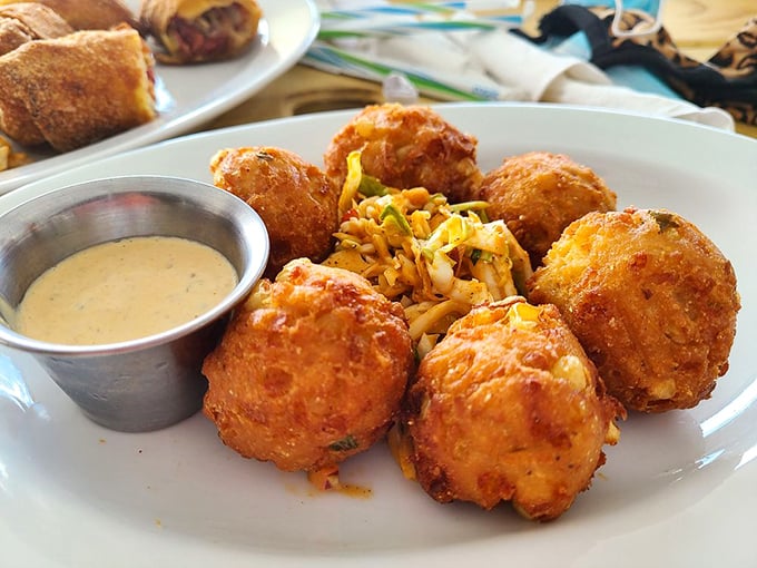 These hush puppies aren't just side dishes&mdash;they're golden orbs of cornmeal perfection that deserve their own spotlight and accompanying sauce. 