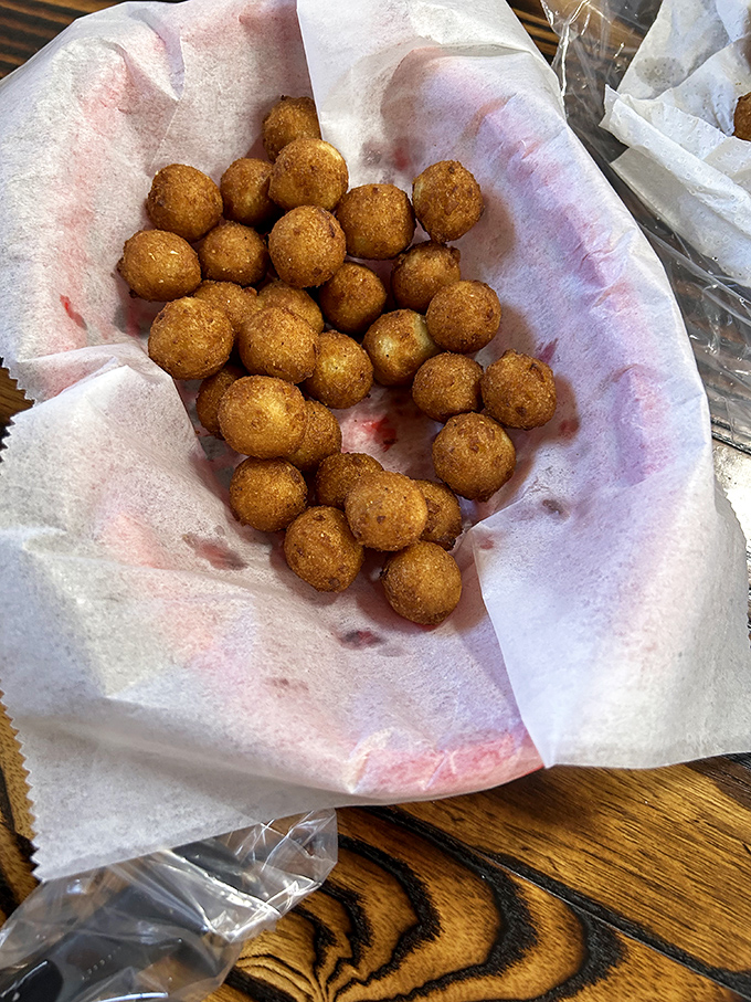 Hush puppies so perfectly golden they deserve their own trophy case. Crispy exterior, pillowy interior – the supporting actors that steal the show.