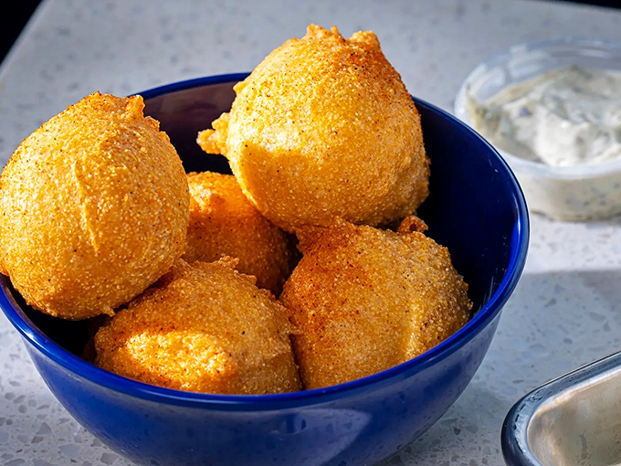 These hush puppies aren't just golden orbs of cornmeal goodness&mdash;they're little spheres of joy that make you wonder why you'd ever waste stomach space on bread.