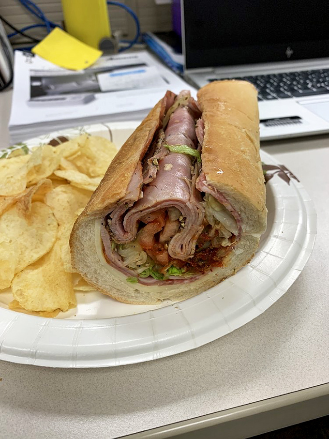 This Italian sub isn't just lunch; it's architecture. Note how the meats are layered with the precision of a Renaissance masterpiece.