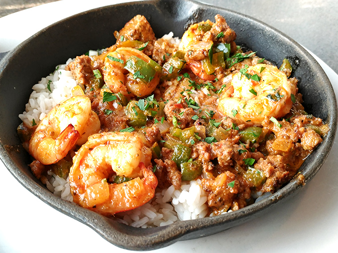 This isn't just jambalaya; it's a spicy celebration in a skillet, with plump shrimp and savory sausage nestled on a bed of rice.