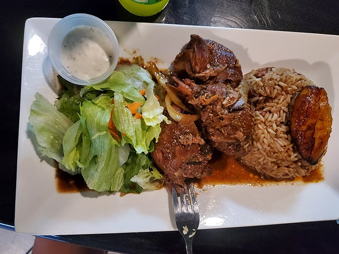 Jerk chicken so authentic it might start speaking with an accent. Served with rice and plantains that aren't just sides&mdash;they're supporting actors deserving their own Oscar.