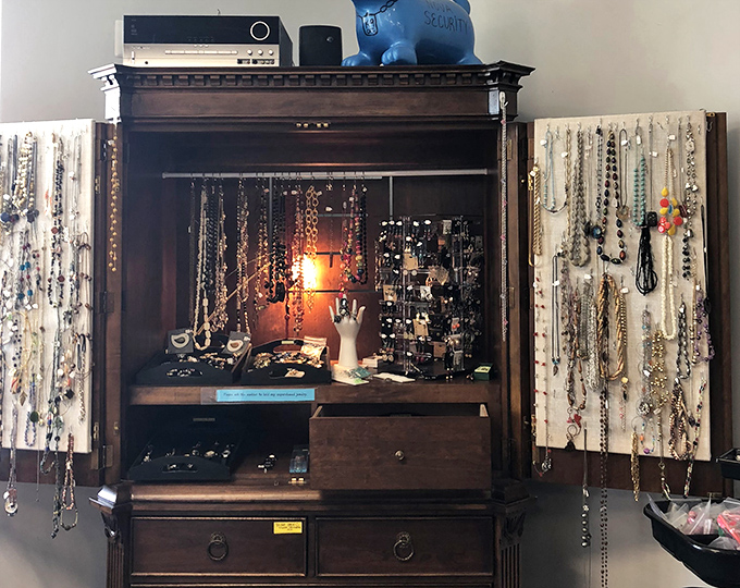 This repurposed armoire showcases jewelry with the dramatic flair of a Broadway stage, complete with spotlight and supporting cast of accessories.