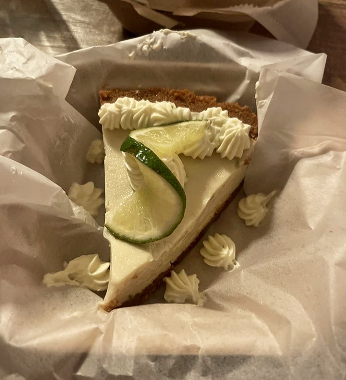 This Key Lime Pie isn't just dessert&mdash;it's Florida sunshine transformed into creamy, tart perfection with dollops of whipped cream like little clouds.