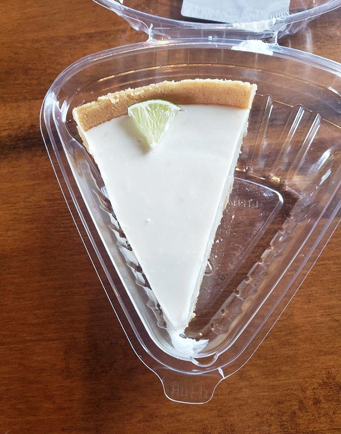 Key lime pie that strikes the perfect balance between tart and sweet, with a slice of lime that's not just garnish but a promise of the citrus punch waiting inside.