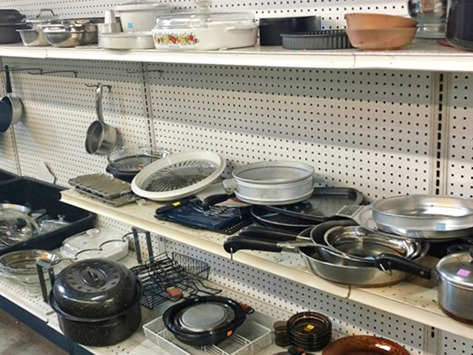 Pots, pans, and possibilities line these shelves. Someone's discarded roasting pan might become your Thanksgiving hero this year.