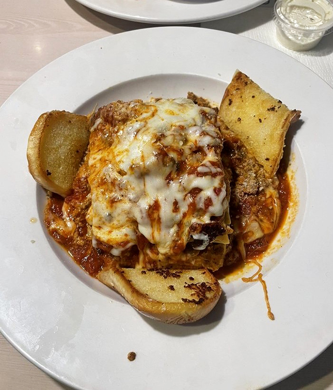 Lasagna that doesn't just sit on the plate—it stakes a claim. Those layers of cheese aren't messing around.