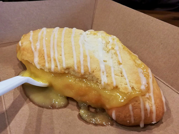 The lemon turnover performs a magic trick: transforming simple citrus into golden, flaky ecstasy that oozes sunshine with every heavenly bite.