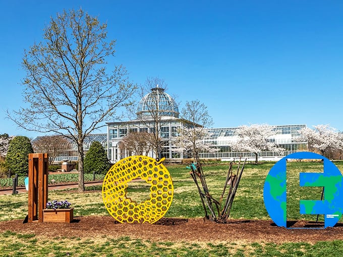 Who says gardens can't have a sense of humor? The LOVE sculpture brings a playful touch to the classical architecture beyond.