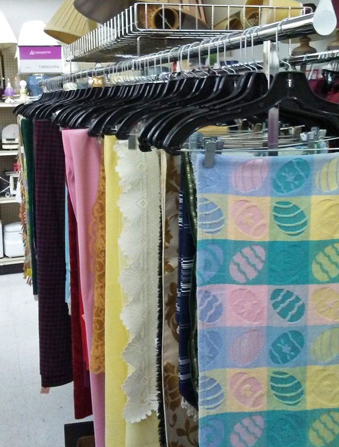 Seasonal linens hang like colorful flags of opportunity. That Easter tablecloth might be perfect for your "Christmas in July" party!