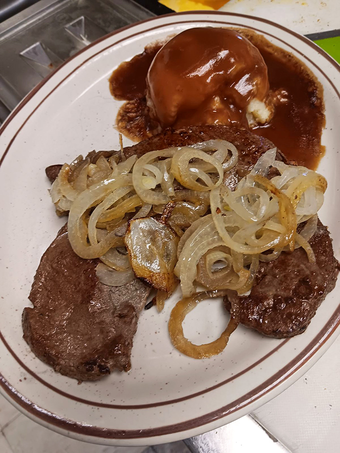 Liver and onions with a side of mashed potatoes&mdash;a dish that separates casual diners from true comfort food connoisseurs.