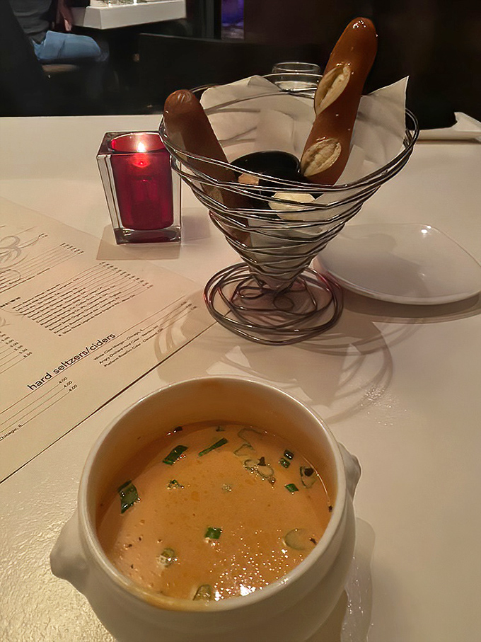 The lobster bisque arrives with pretzel breadsticks standing at attention, as if they know they're about to meet culinary greatness.