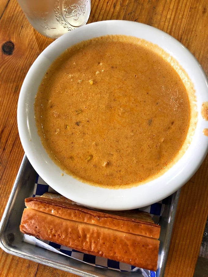 This amber-hued lobster bisque isn't just soup&mdash;it's liquid gold. Those buttery breadsticks are basically edible spoons for the seafood treasure hunt.