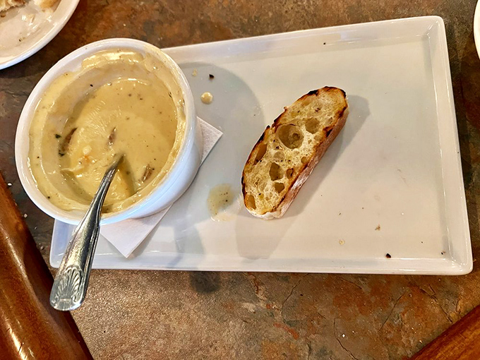 The legendary lobster fondue arrives like a pot of liquid gold, studded with treasures from the deep that will haunt your dreams.