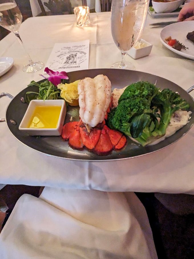 Lobster tail and steak—the Fred Astaire and Ginger Rogers of fine dining, dancing together in perfect harmony on this elegant plate.