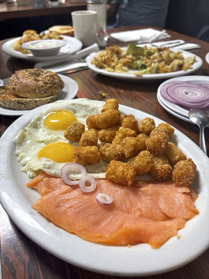 Lox, eggs, and those gloriously golden tater tots create a breakfast that bridges deli tradition with diner comfort&mdash;the breakfast equivalent of a warm hug.