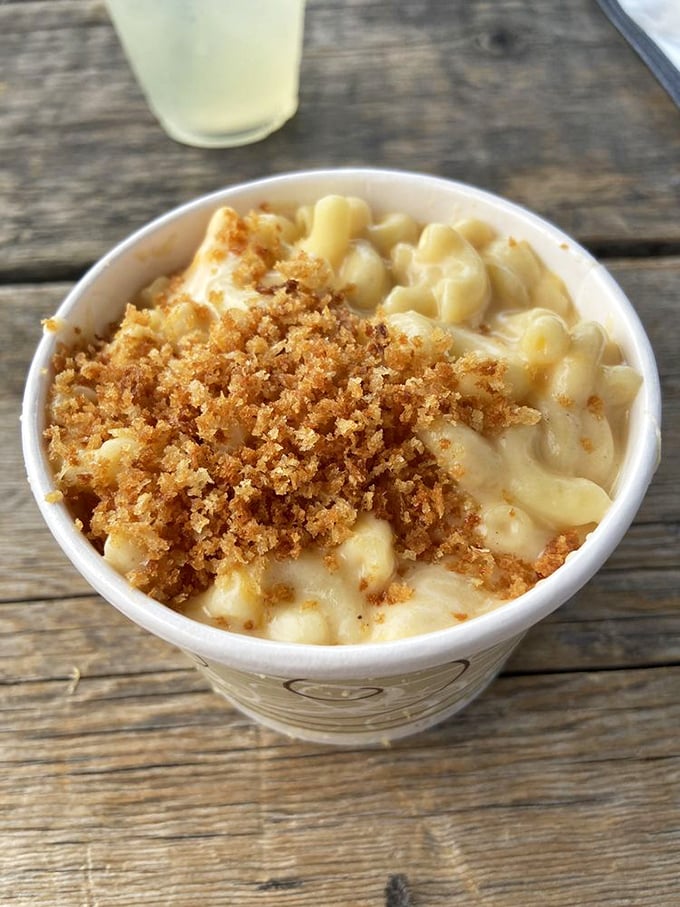 Mac and cheese topped with golden breadcrumbs &ndash; comfort food that's dressed up for the party but still knows how to let loose.