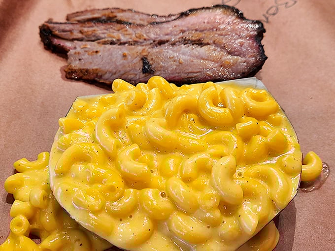 Mac and cheese so gloriously yellow it could guide ships to shore. This isn't side dish territory—it's main attraction material.