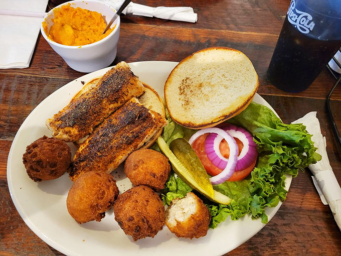 Sweet potato casserole meets blackened fish in a plate that screams "Southern comfort." Those hush puppies are making another appearance because, well, why wouldn't they?