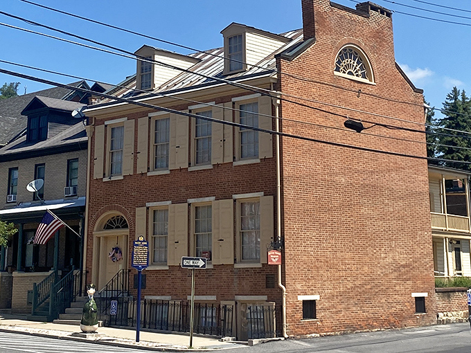 The McCoy House stands as a perfectly preserved slice of 19th-century architecture, brick and shutters telling stories that predate Netflix.