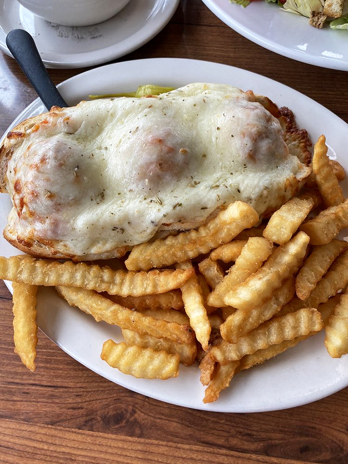 Melted cheese cascading over Italian meatballs &ndash; this isn't just a sandwich, it's an engineering marvel of comfort food.v