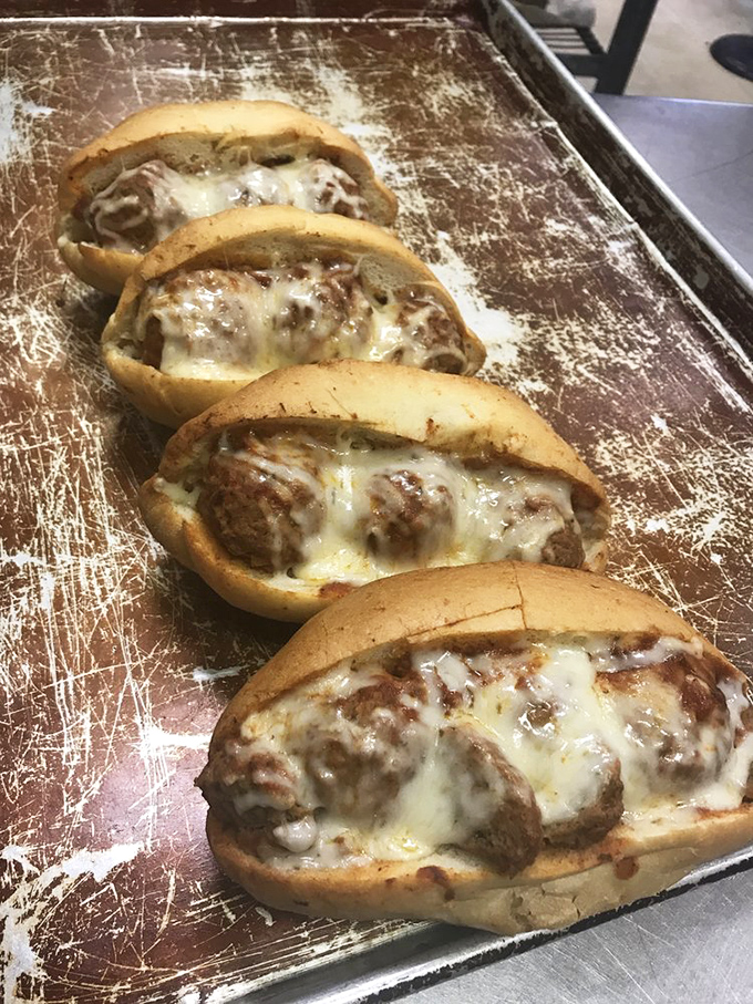 Meatball subs that mean business&mdash;tender spheres of seasoned meat nestled in fresh bread and blanketed with melted cheese. Resistance is futile.