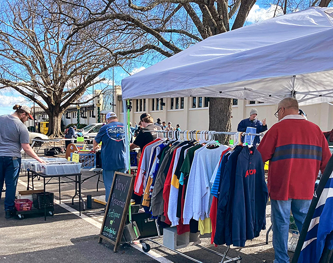 The outdoor vendor section: where vintage clothing hunters gather at dawn like caffeinated wildlife documentarians, ready to pounce on that perfect 1980s windbreaker.