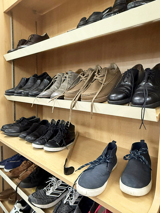 Men's shoes lined up like hopeful dance partners at a sock hop, each pair waiting for someone to take them for a spin around town.