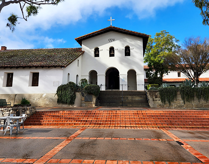 Mission San Luis Obispo de Tolosa radiates timeless serenity with its classic white adobe walls. 