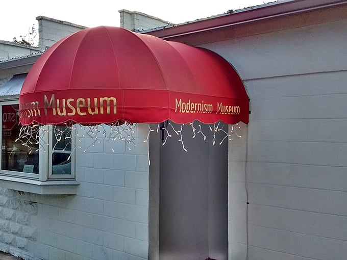 The Modernism Museum's distinctive red awning signals you're about to experience art that breaks rules in the best possible way.