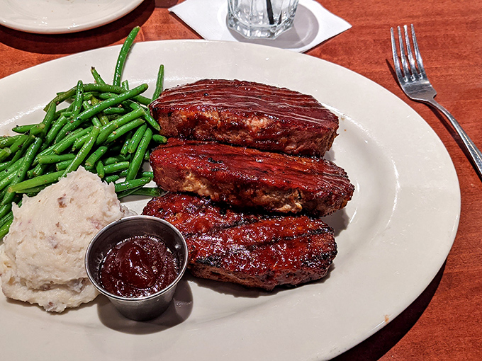 The New York strip arrives like a work of art&mdash;blushing pink center, caramelized exterior, and a side that knows its supporting role but still shines.