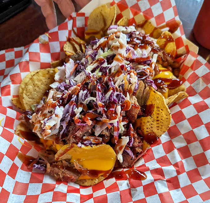BBQ nachos: where Tex meets Mex in perfect harmony. A mountain of chips supporting pulled pork, cheese, and slaw&mdash;like edible Jenga for grown-ups.