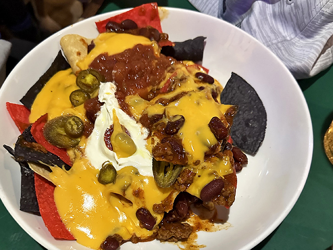These nachos aren't just a snack, they're an architectural achievement &ndash; layers of flavor supporting a delicious cheese-covered democracy. 
