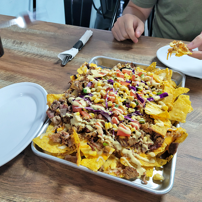 Loaded nachos that require a strategy to eat&mdash;each chip a vehicle for maximum topping delivery. The kind of sharing plate nobody wants to share.