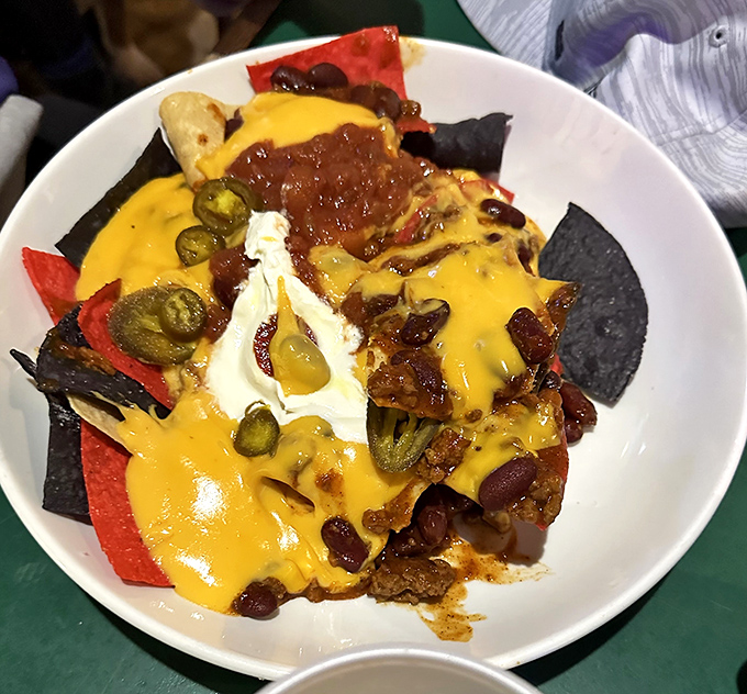 These Nachos Grande aren't messing around&mdash;a mountain of tortilla chips buried under an avalanche of cheese, chili, and jalape&ntilde;os that demands to be shared.