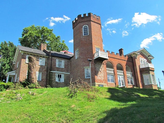 Nemacolin Castle rises from the hillside like something from a storybook, its distinctive tower keeping watch over the river valley below.