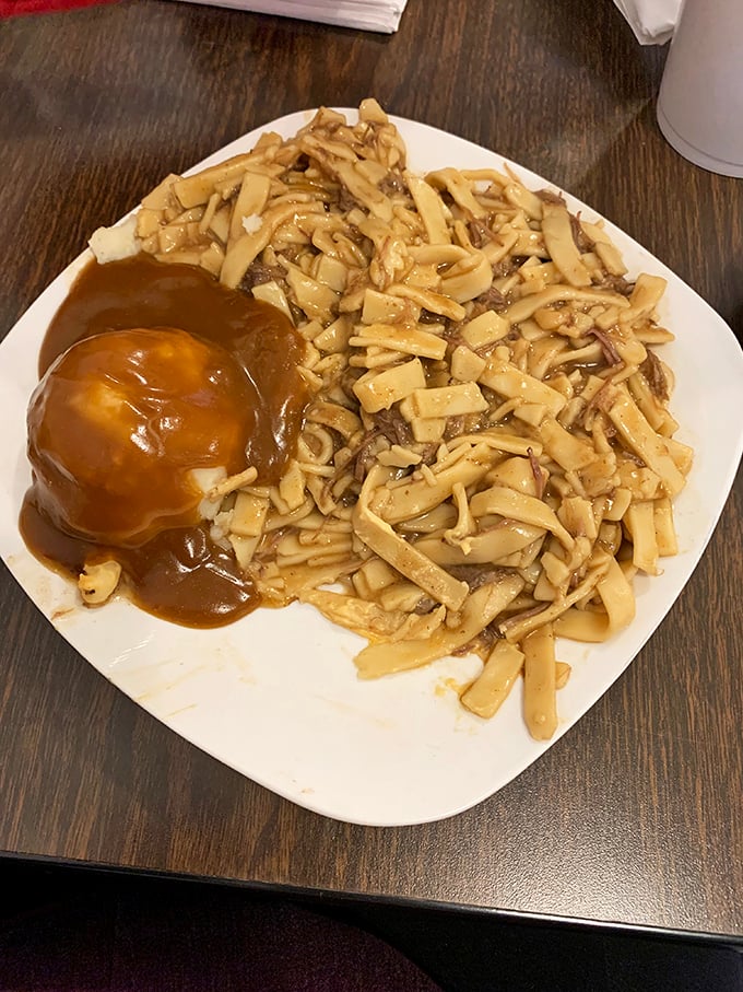 Comfort food doesn't get more comforting than this &ndash; homestyle noodles and mashed potatoes smothered in gravy that could solve world peace.