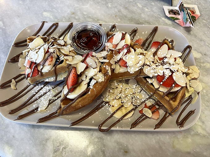 Waffles that crossed the line from breakfast to dessert and never looked back. Those strawberries are just there to help you pretend it's healthy.