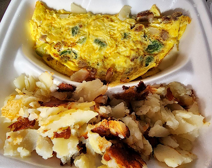 This fluffy omelet paired with perfectly seasoned home fries delivers breakfast bliss on every single bite.