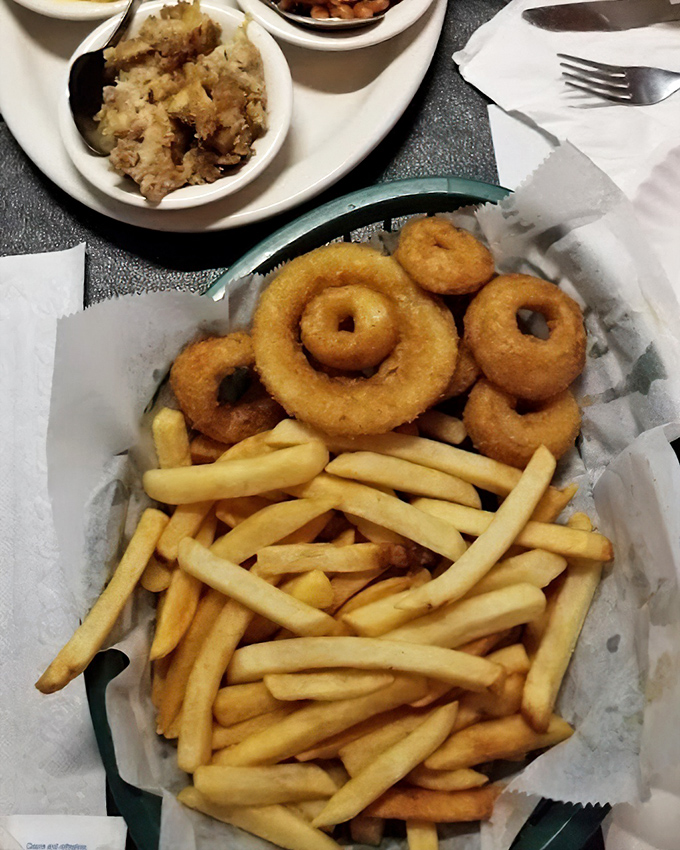 Golden, crispy onion rings and fries—the supporting actors that deserve their own standing ovation. The perfect vehicle for any leftover sauce.