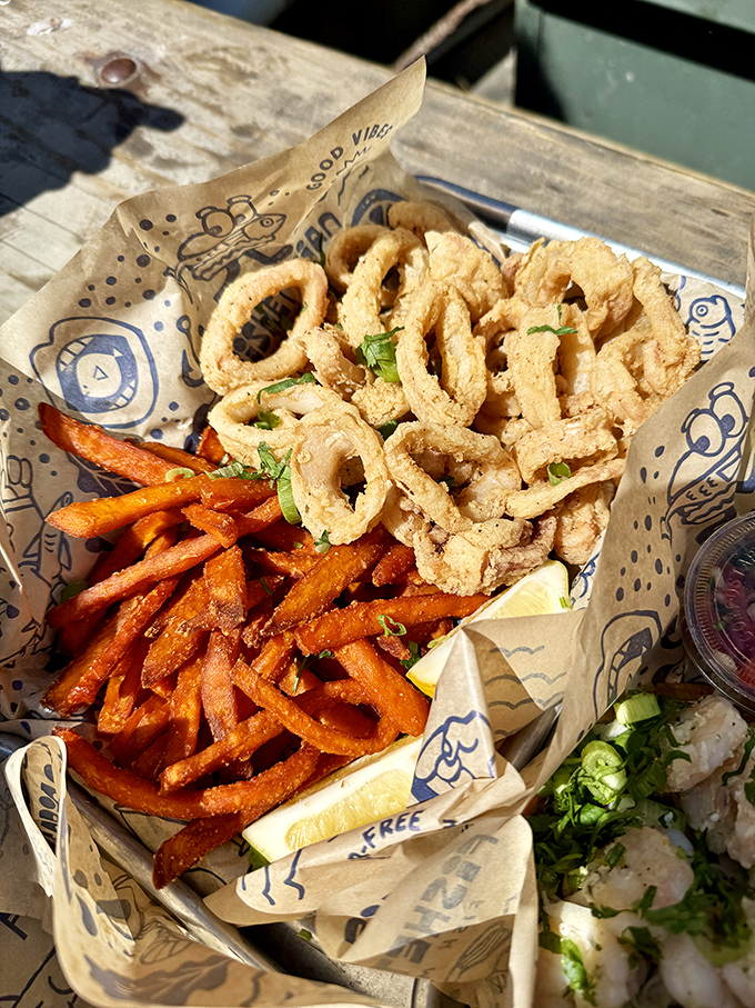 A seafood trio that hits all the right notes&mdash;crispy calamari, sweet potato fries, and something fresh that makes you feel slightly virtuous while indulging.