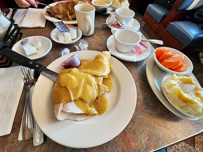 Open-faced turkey drowning in gravy with sides that don't know they're supposed to be supporting actors&mdash;they're all stars here.