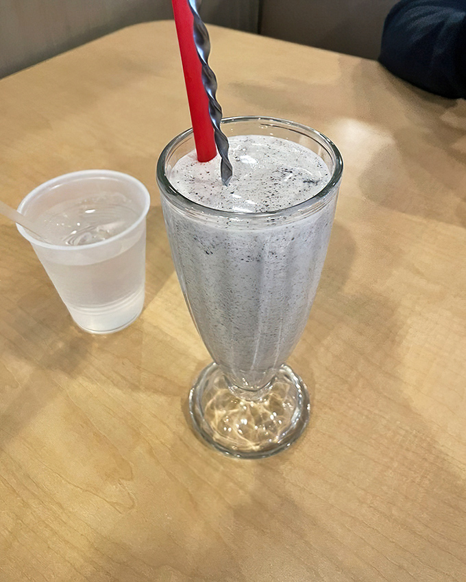 The straw stands at attention for good reason. This Oreo milkshake is thick enough to require muscle but rewards your effort with creamy, cookie-studded bliss.