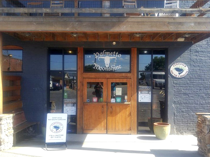 Palmetto Moonshine's rustic wooden entrance promises authentic Southern spirits inside&mdash;where tradition meets glass bottles and possibly questionable decision-making.