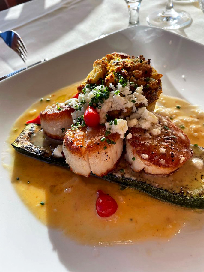 These scallops aren't just seared&mdash;they're transformed into buttery medallions of oceanic perfection, resting on a zucchini throne worthy of Neptune himself.