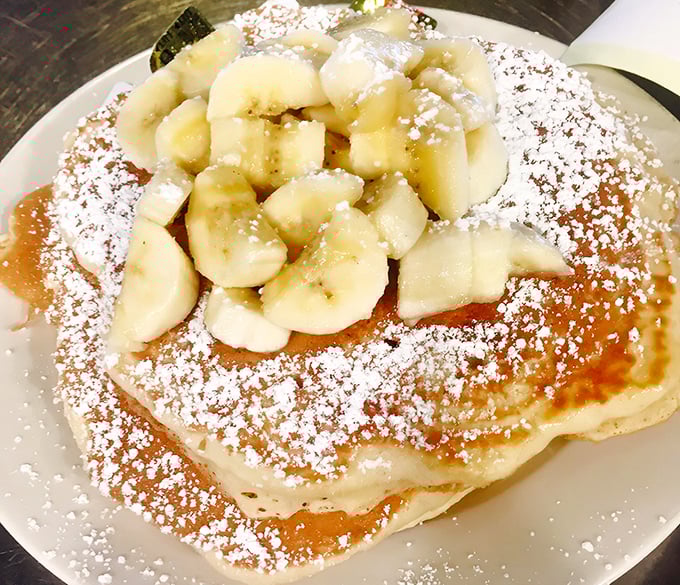 Pancakes crowned with bananas and powdered sugar&mdash;the breakfast equivalent of wearing a tiara to start your day right.