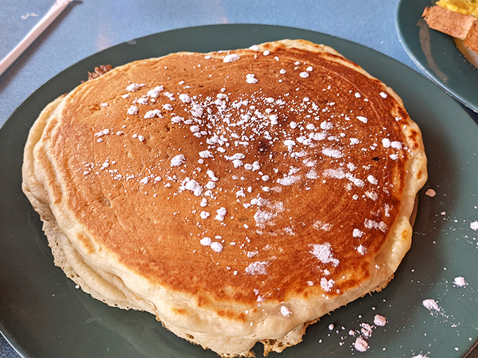This pancake could double as a dinner plate, dusted with powdered sugar like fresh snowfall.