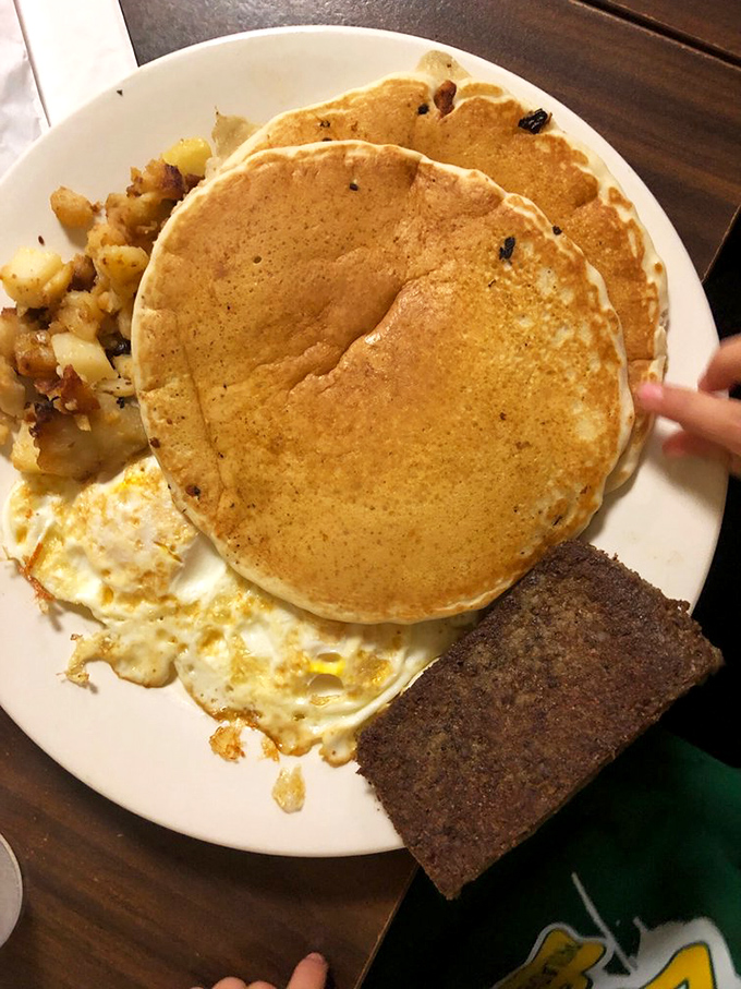 These pancakes aren't just big&mdash;they're life-affirming. Golden discs of joy that hang over the plate's edge like delicious solar eclipses.