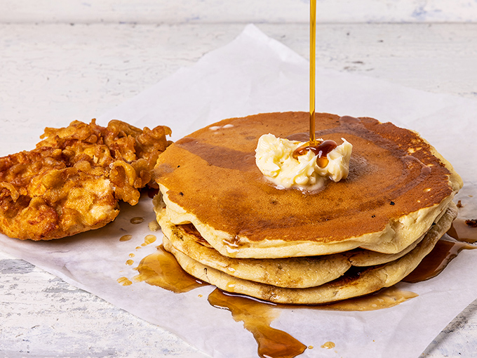 Pancake perfection with honey cascading like liquid gold. That crispy fried chicken sidekick creates the breakfast duet your taste buds have been rehearsing for.